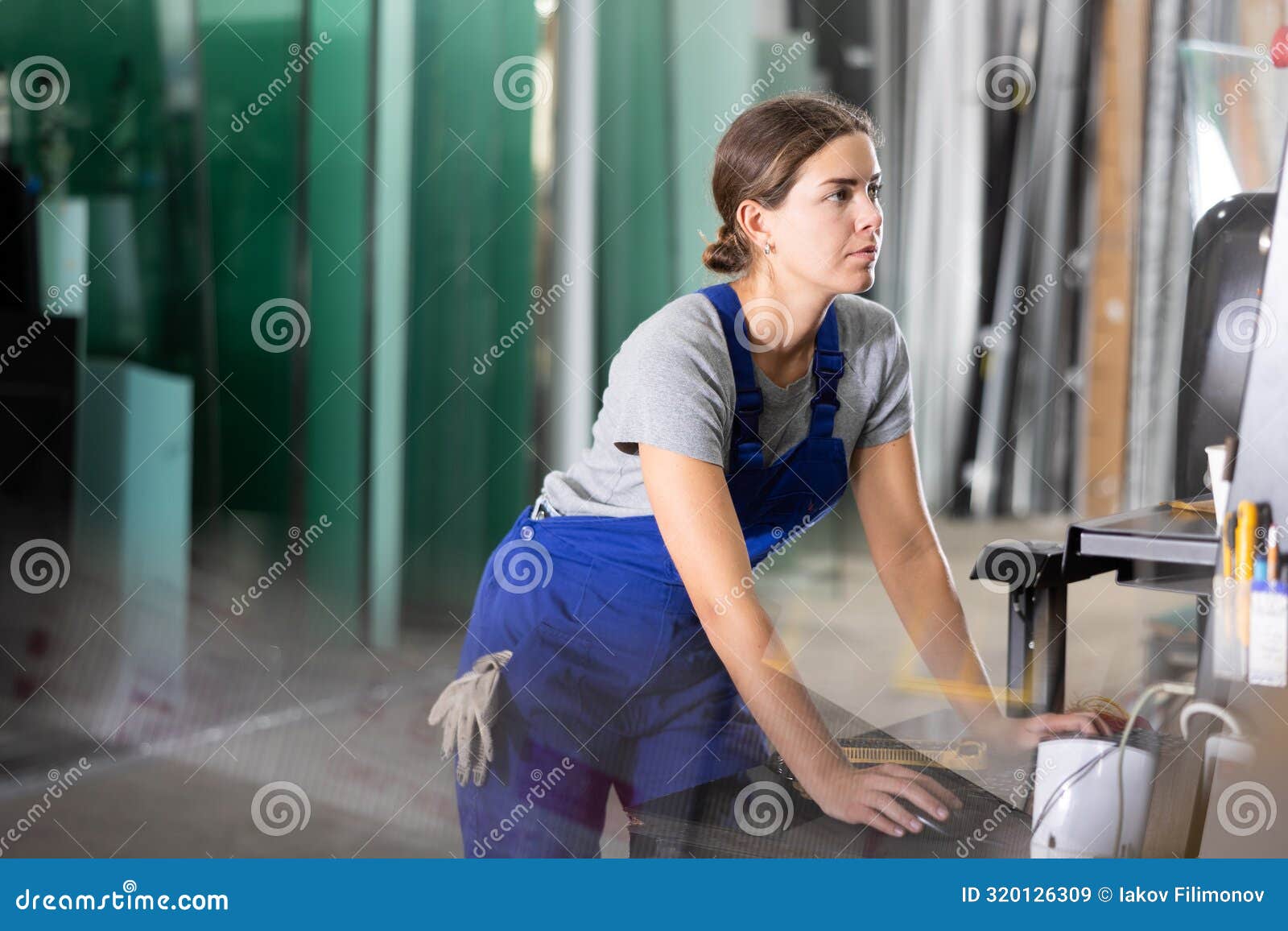 Glass Factory Worker at Workplace with Control Panel, Controlling ...