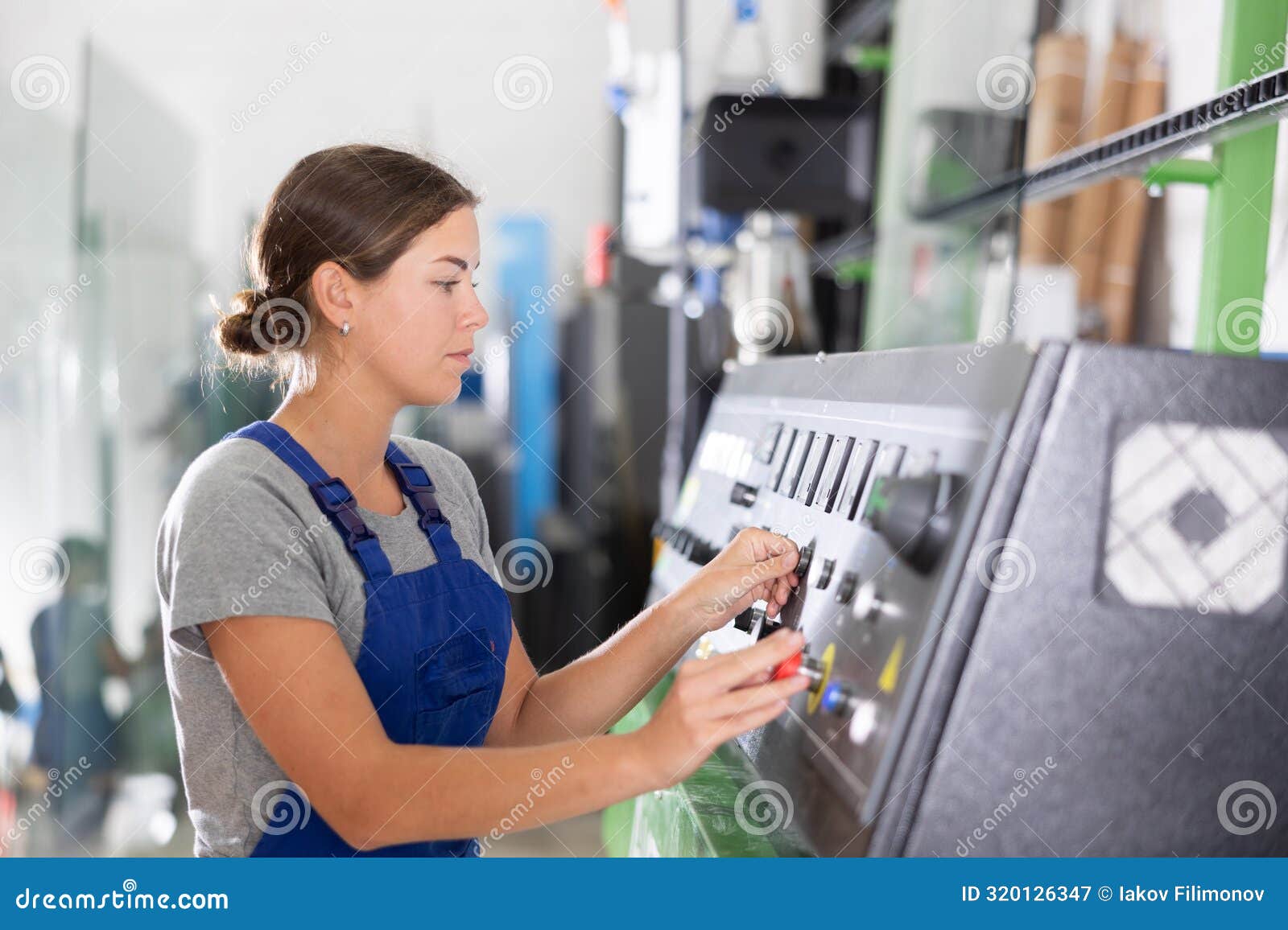 Glass Factory Worker at Workplace with Control Panel, Controlling ...