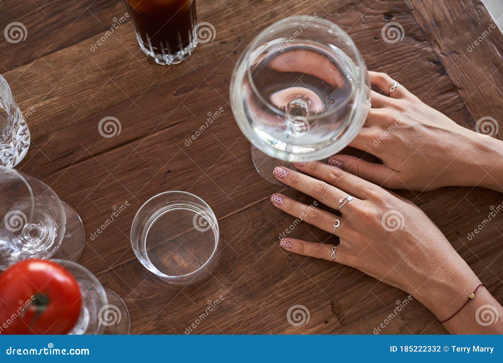A glass in female hands stock photo. Image of appointment - 185222332