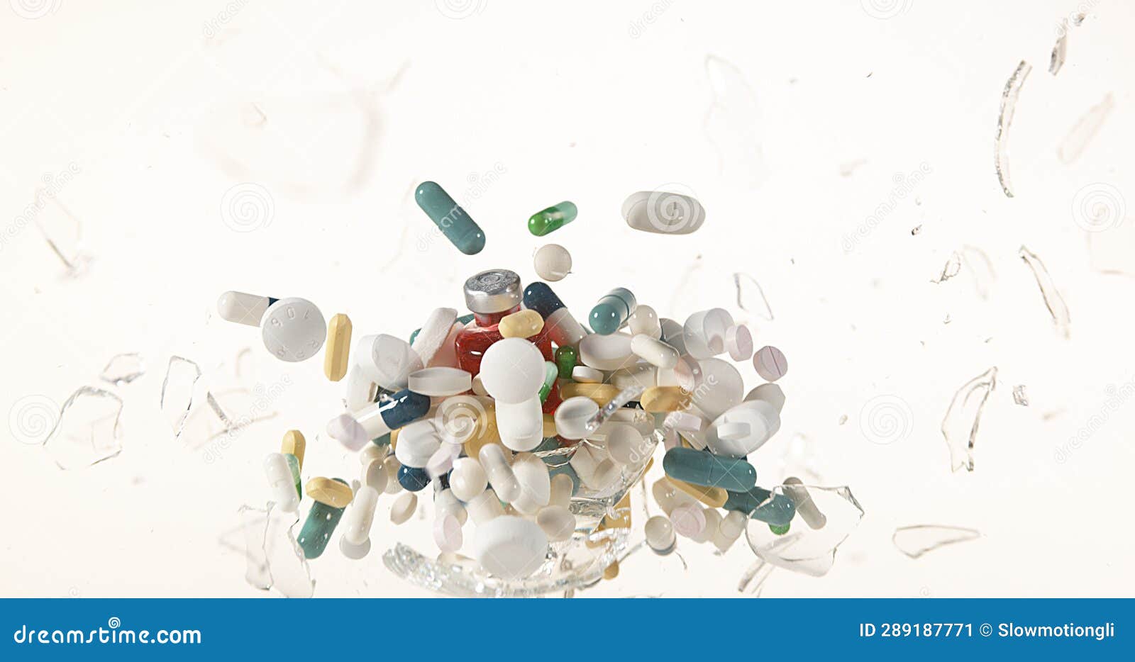 Glass Filled with Capsules Exploding Against White Background Stock ...