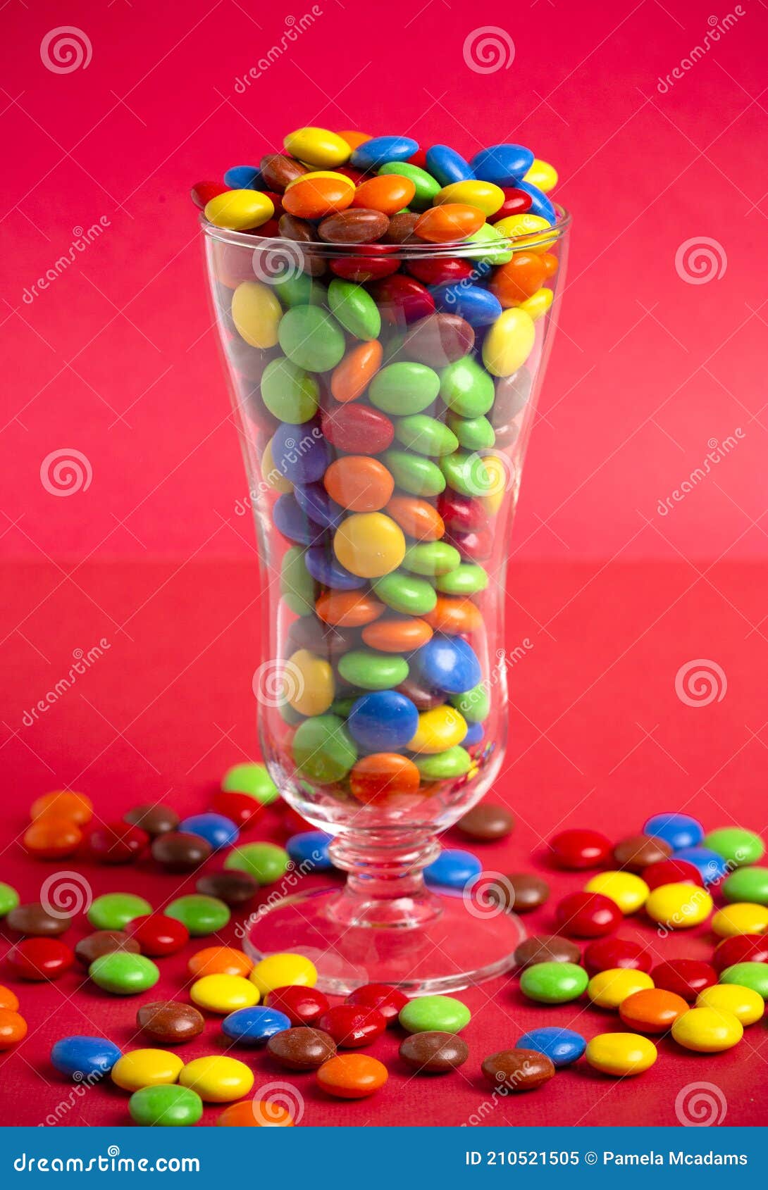 Glass Filled with Rainbow Colored Candy Coated Chocolate Buttons Stock ...