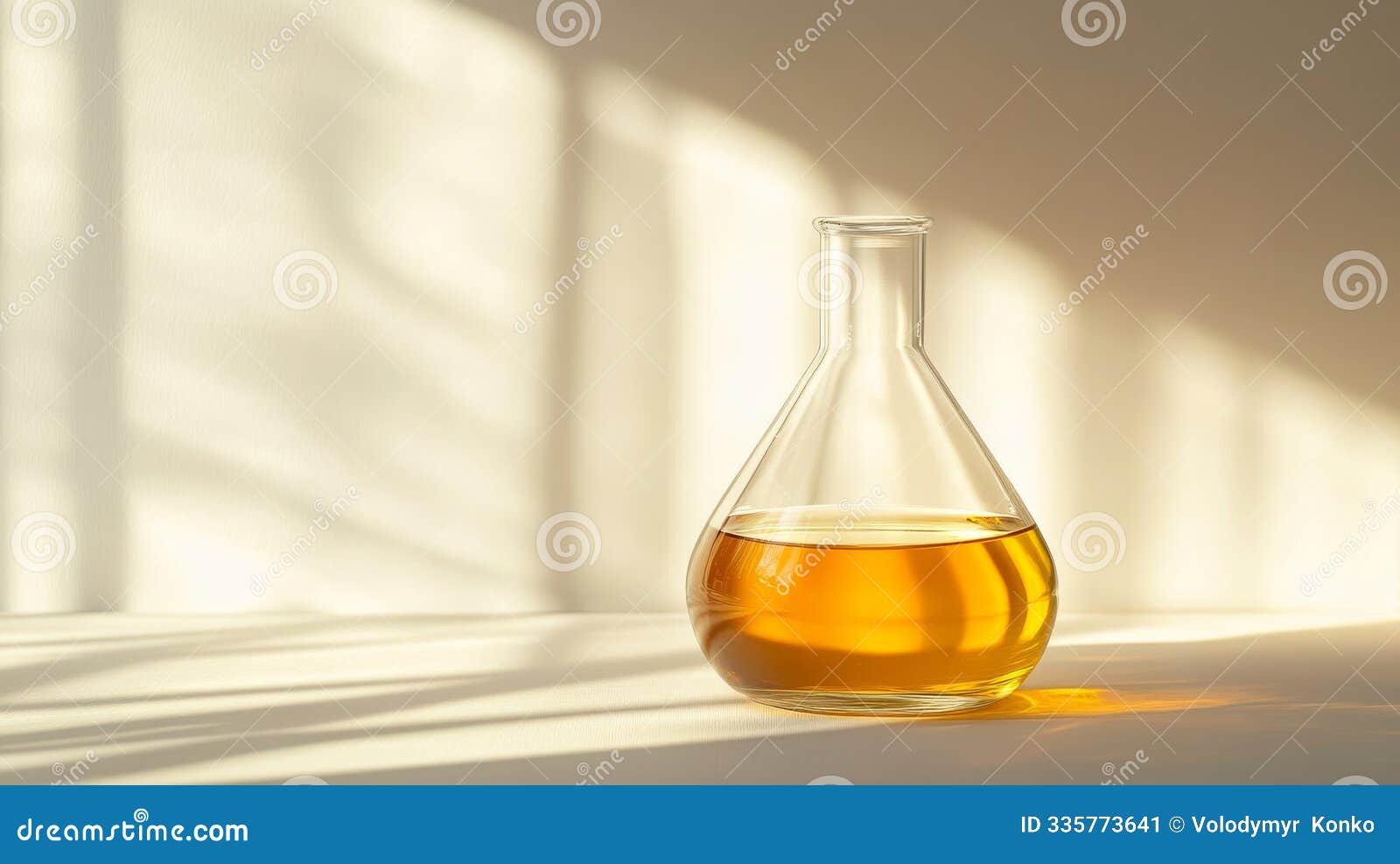 Glass Flask with Amber Liquid in Sunlight on Neutral Background ...