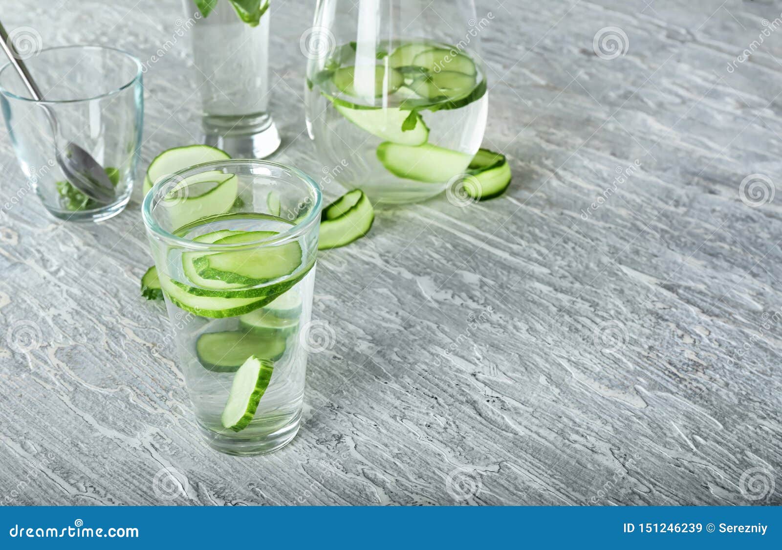 Glass of Fresh Cucumber Water on Light Table Stock Image - Image of ...