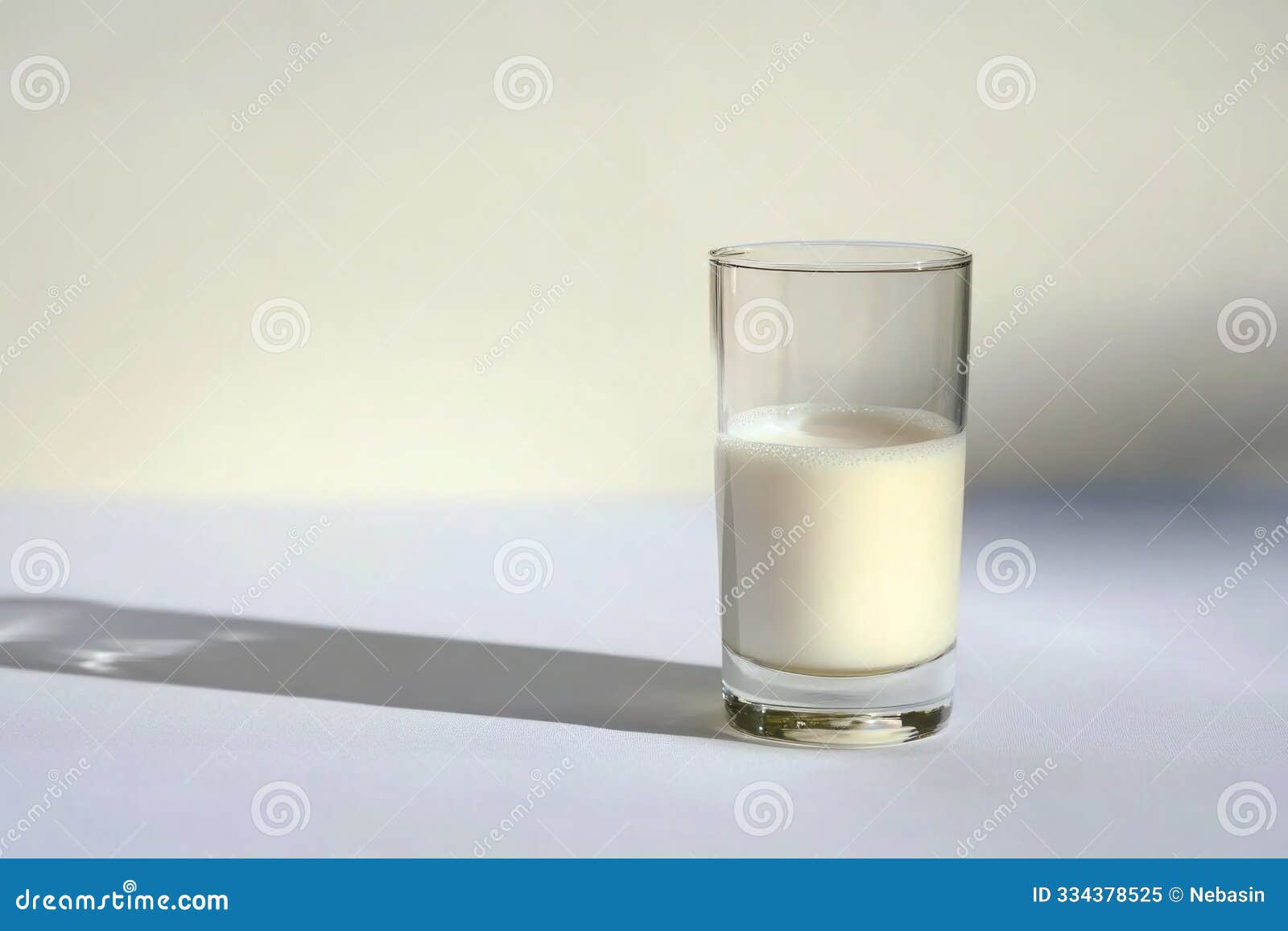 A Glass of Fresh Milk with Shadow on White Background in Natural Light ...