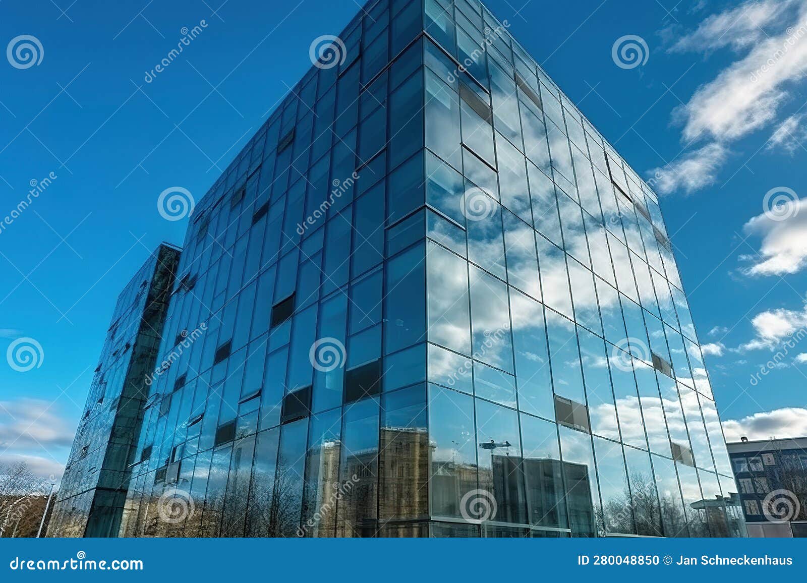 Glass Fronted Contemporary Office Building with a Backdrop of a Blue ...