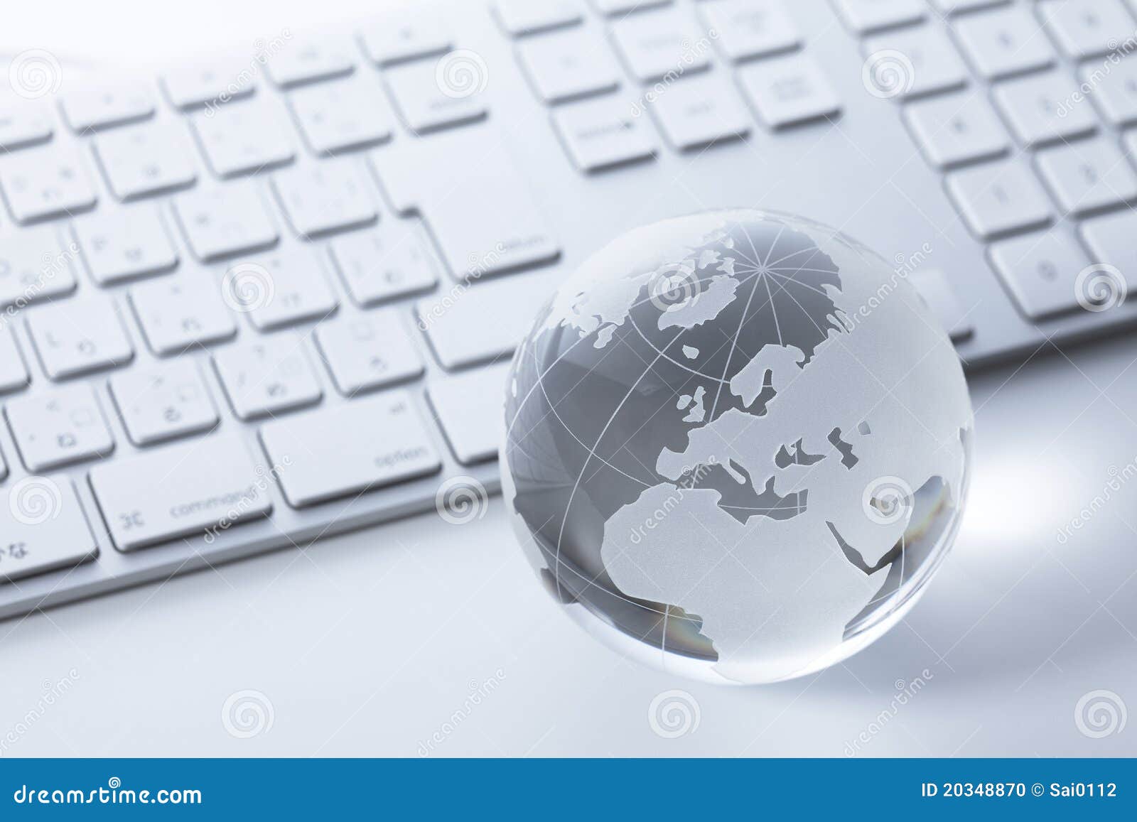 Glass globe on a keyboard stock photo. Image of computer - 20348870