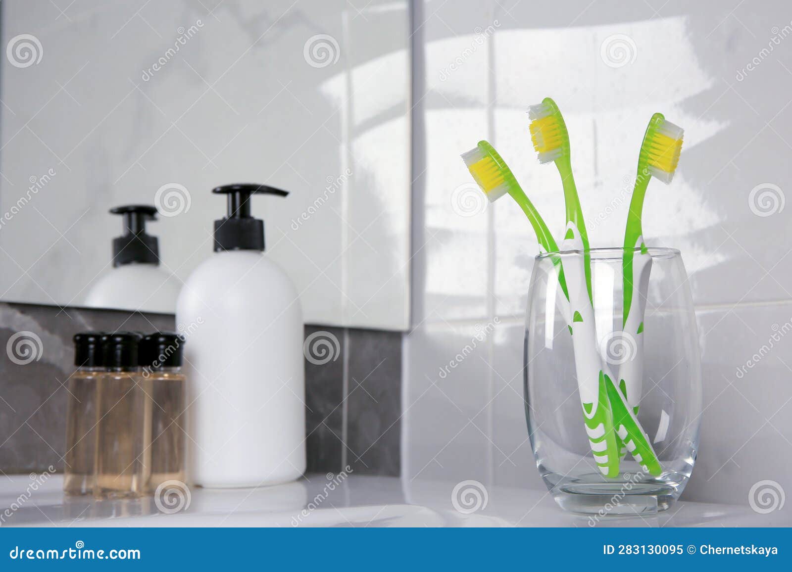 Glass Holder with Light Green Toothbrushes in Bathroom Stock Image ...