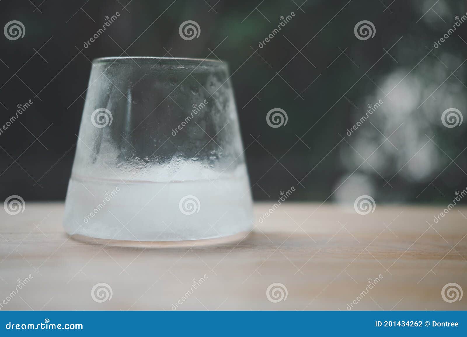 Glass with Ice Freeze on Wood Table Stock Photo - Image of iceberg ...