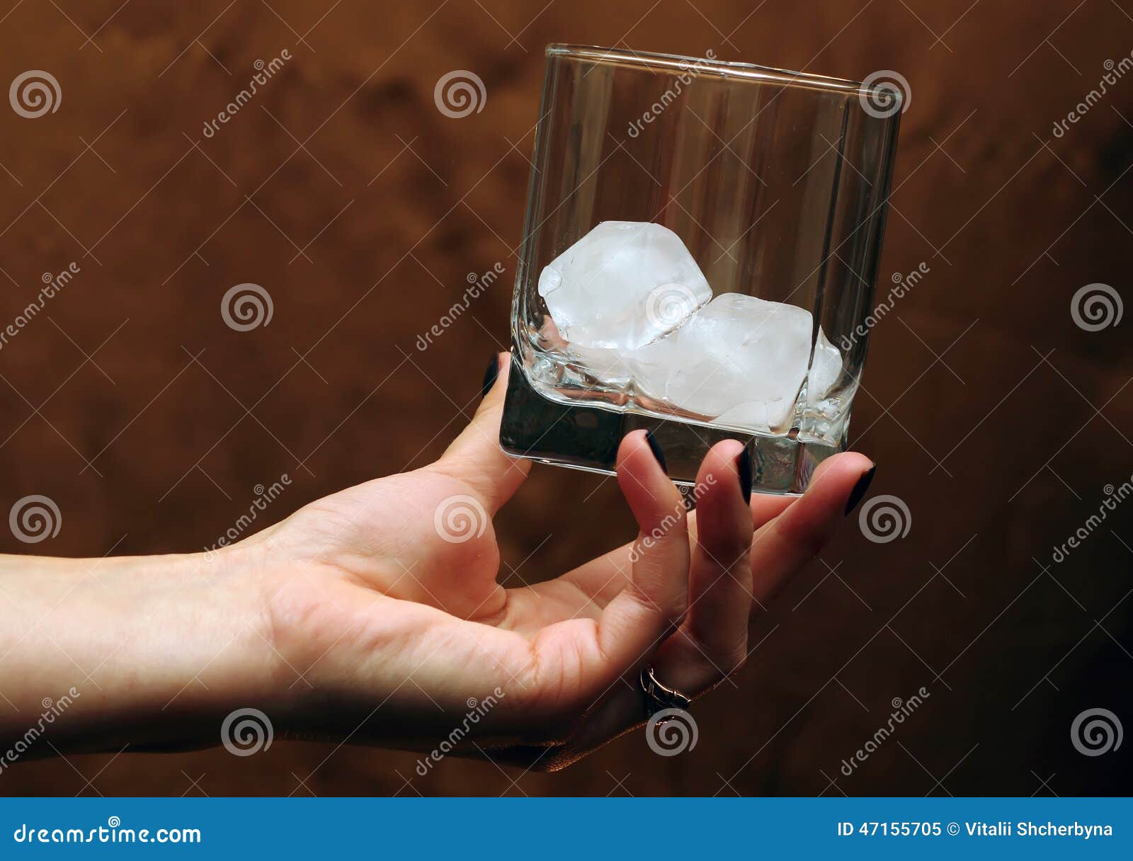 Glass with ice in Hand stock image. Image of beverage - 47155705