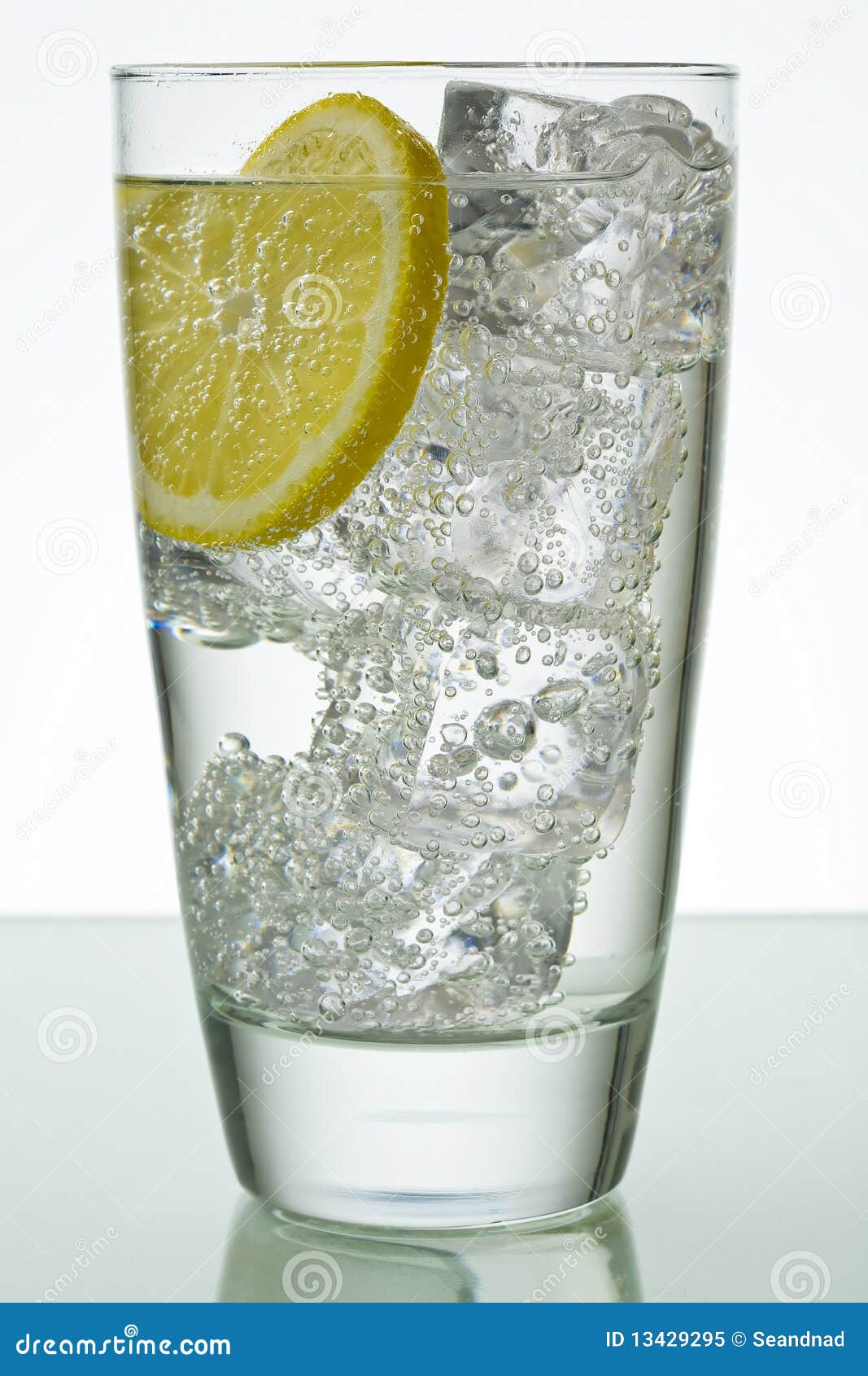 Glass with ice and lemon stock image. Image of glass - 13429295