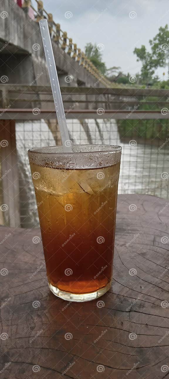 A glass of ice tea stock photo. Image of wood, lighting - 266379034