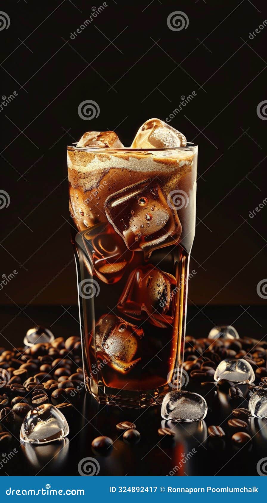 A Glass of Iced Coffee with Ice Cubes and Coffee Grounds on the Table ...