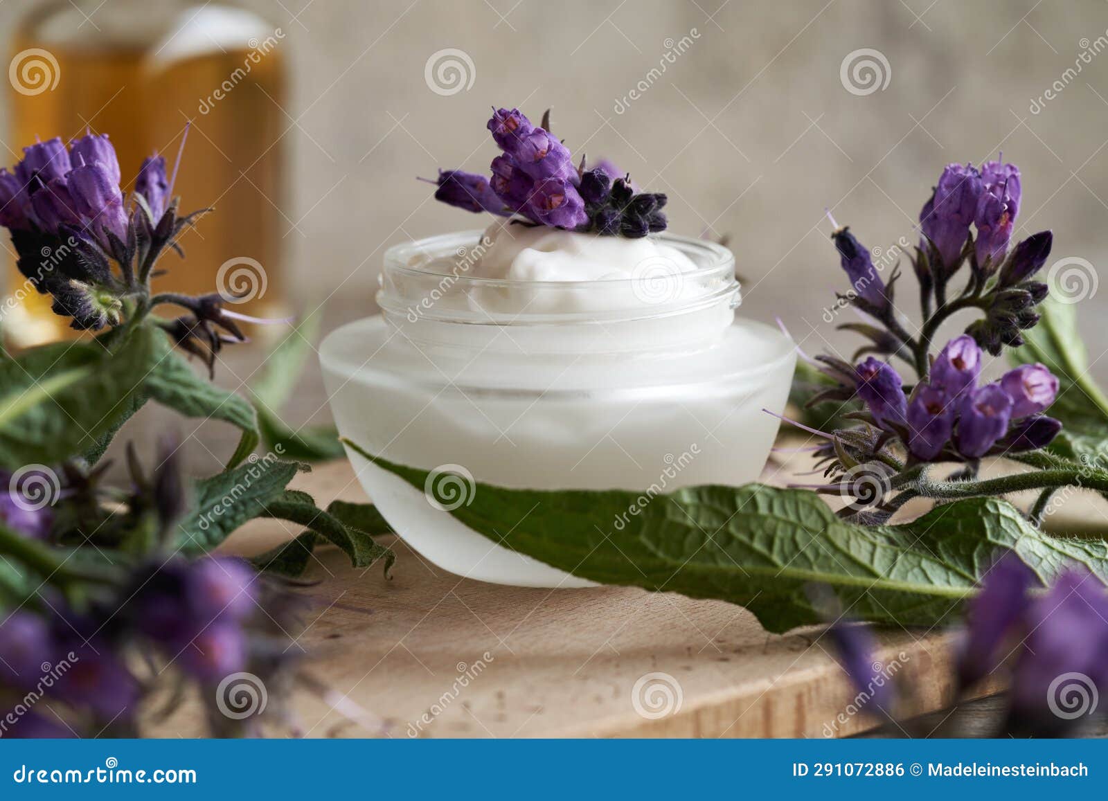 A Jar of Comfrey Root Ointment with Fresh Knitbone Flowers Stock Photo ...