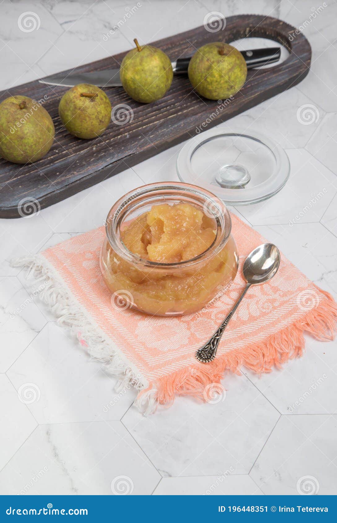 Glass Jar with Mashed Pears and Fresh Pears on a Wooden Cutting Board ...