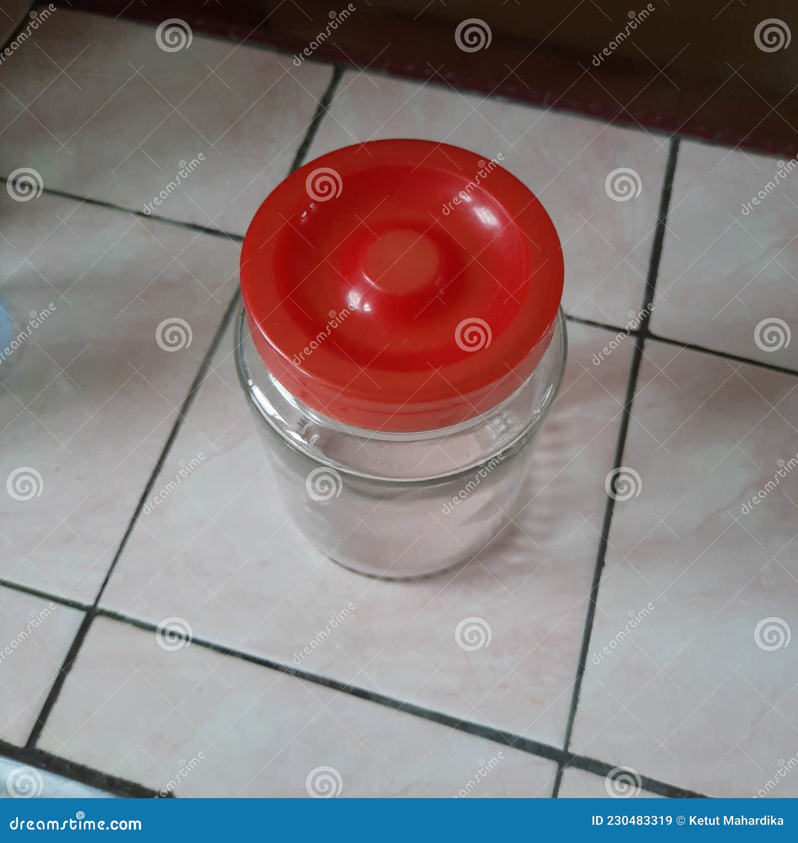 A Glass Jar with Red Lid. stock image. Image of orange - 230483319
