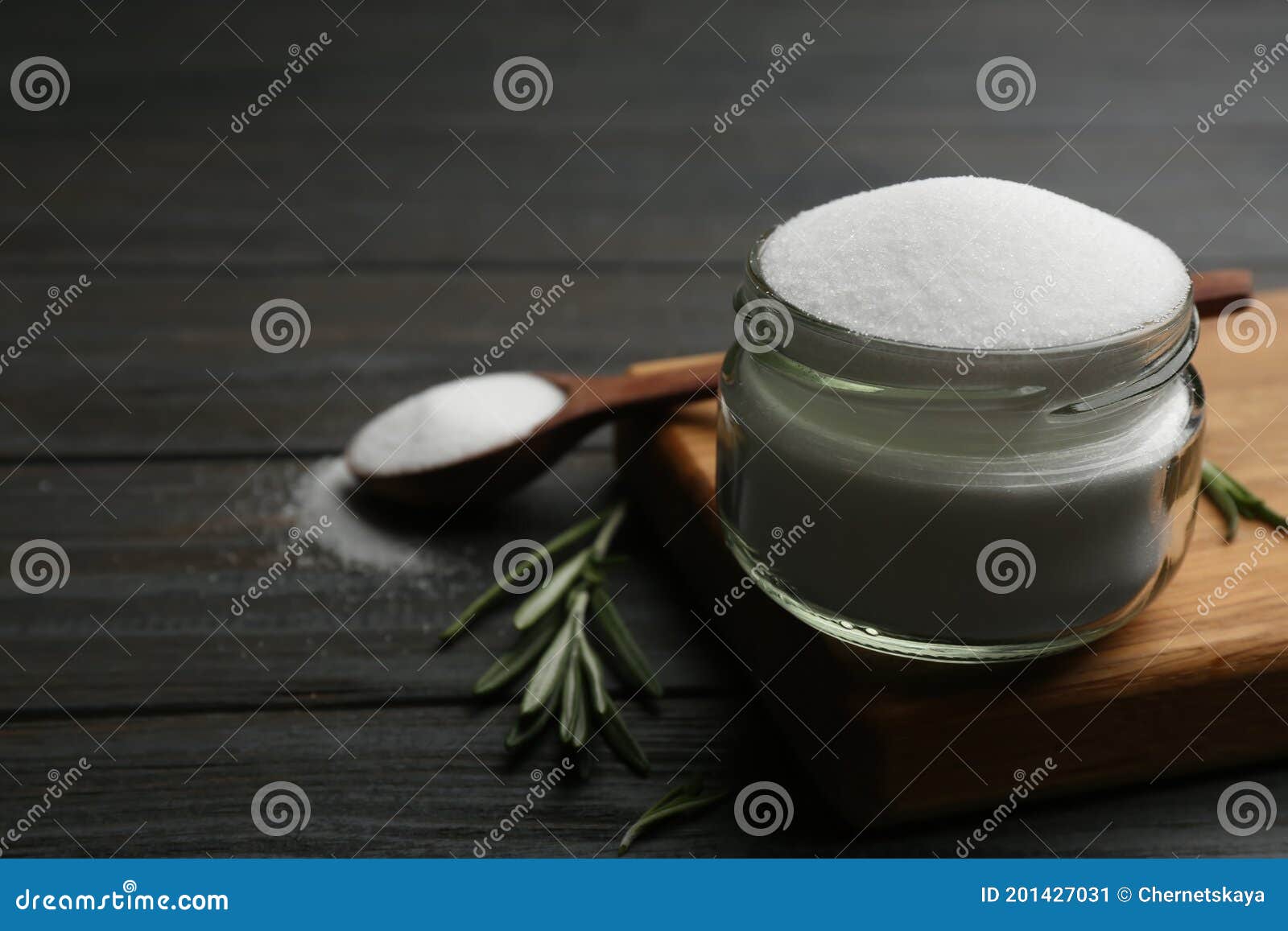 Glass Jar with Salt on Black Wooden Table, Closeup Stock Image - Image ...