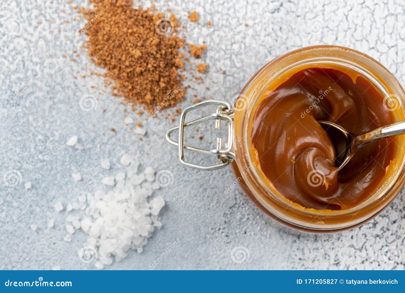 Glass Jar with Salted Caramel and Spoon on Light Background, Copy Space ...
