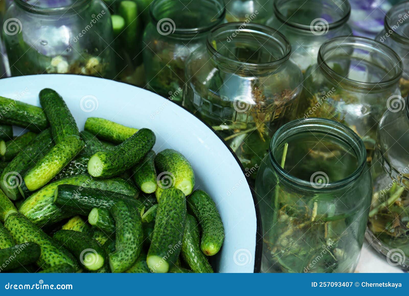 Glass Jars with Different Herbs and Fresh Cucumbers on Table. Pickling ...