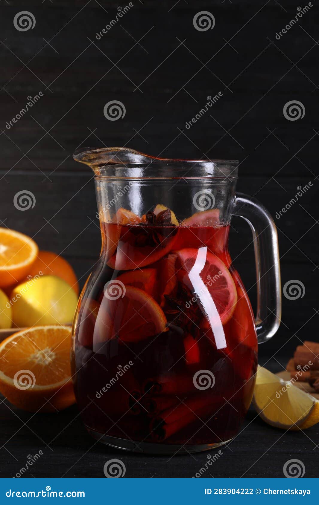 Glass Jug of Aromatic Punch Drink and Ingredients on Black Table Stock ...