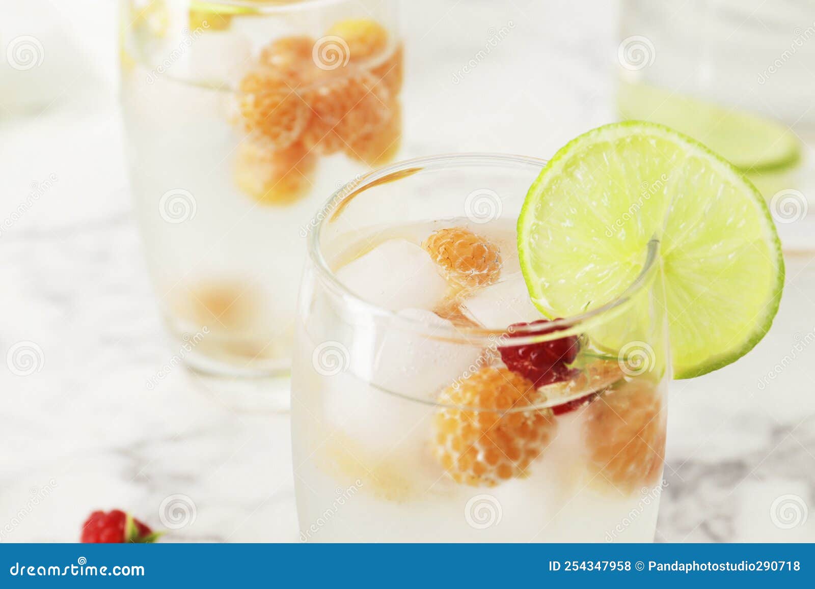 Glass and Jug with Fresh Water and Lime on Marble Table. Space for Text ...