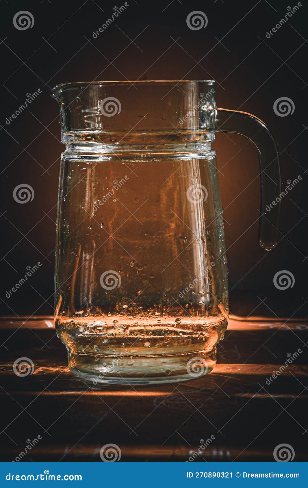 A glass jug on the table stock image. Image of beer - 270890321