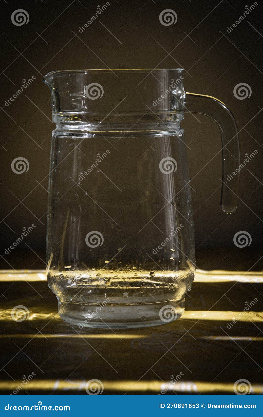 A glass jug on the table stock image. Image of beer - 270891853