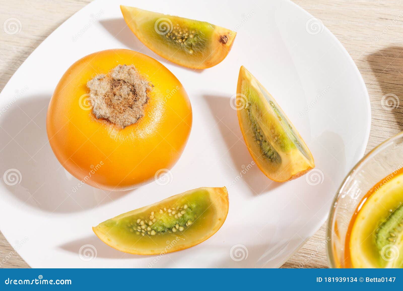 Glass with Juice and Slices of Lulo Fruit, on the Table Stock Photo ...