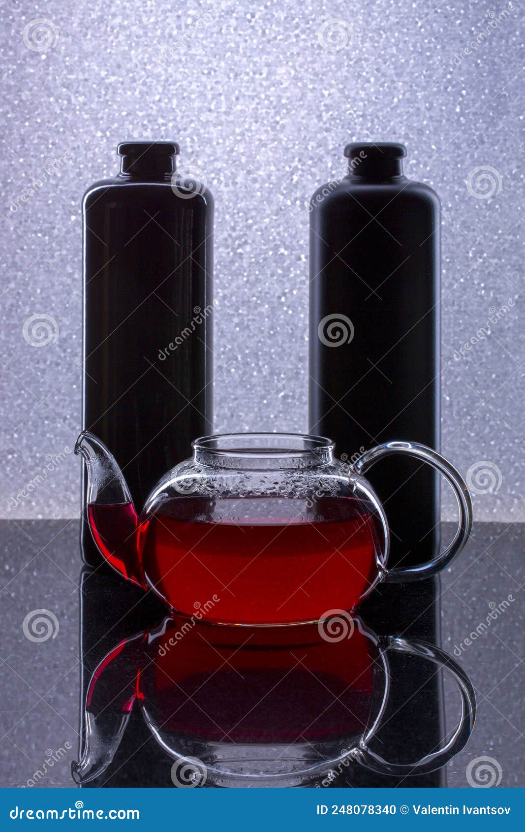 Glass Kettle with Red Liquid and Two Dark Bottles Stock Photo - Image ...
