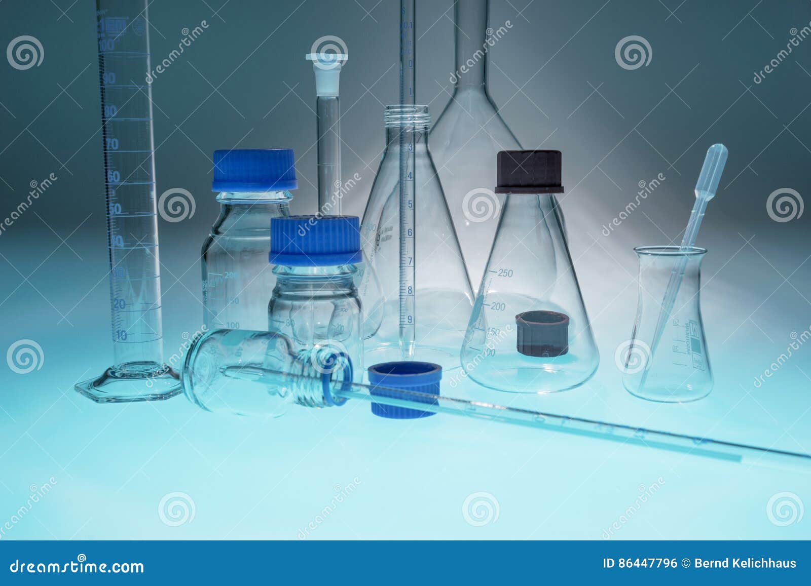 Glass Laboratory Apparatus on Blue Table Stock Photo - Image of ...
