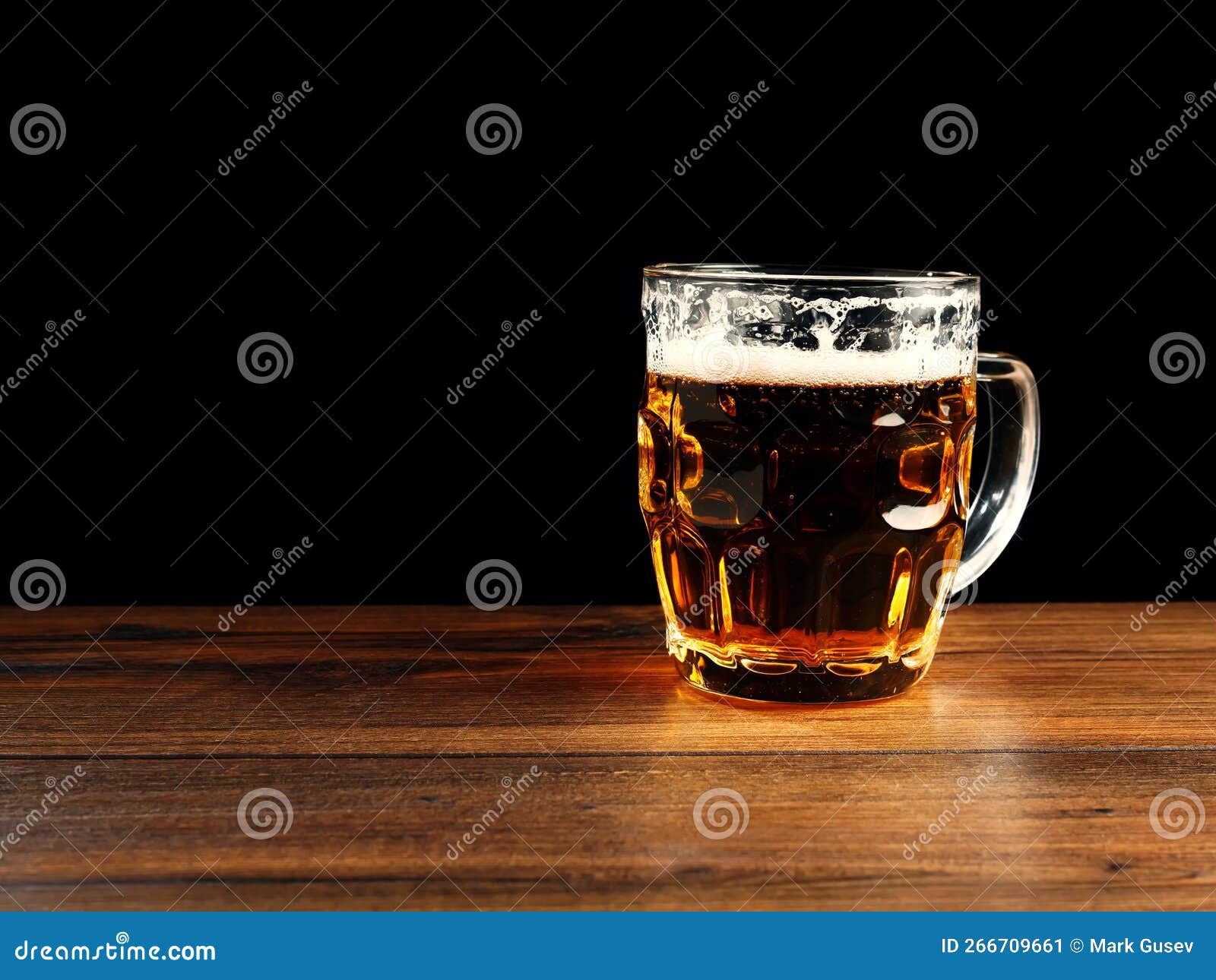 Glass of Lager Beer on a Brown Wood Table. Dark Background. Alcohol ... Glass of Lager Beer on a Brown Wood Table. Dark Background. Alcohol ...