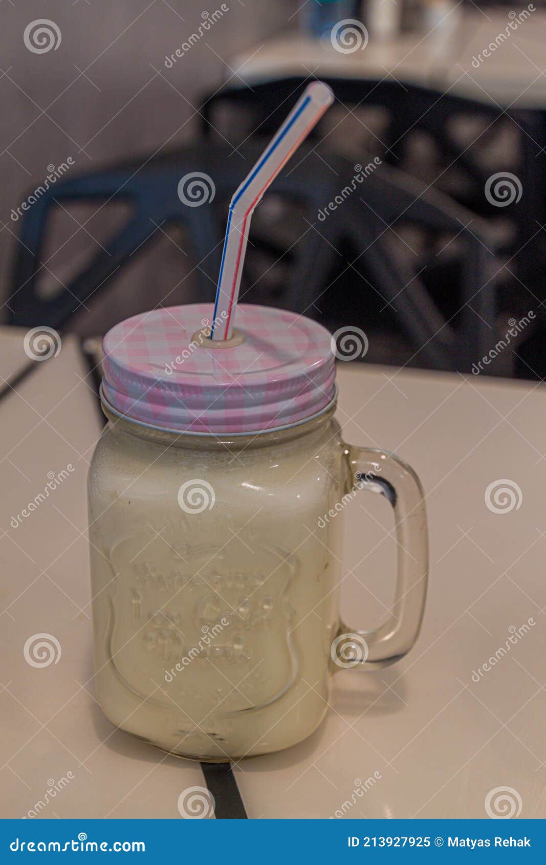 Glass of lassi with a str stock image. Image of kefir - 213927925