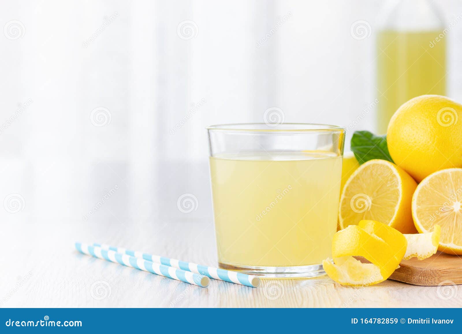 A Glass of Lemon Juice and Lemons Stock Image - Image of cocktail, sour ...