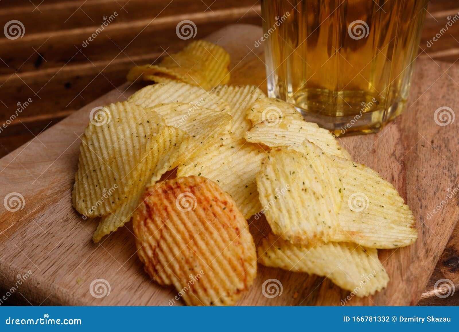 Glass of beer and chips stock photo. Image of golden - 166781332