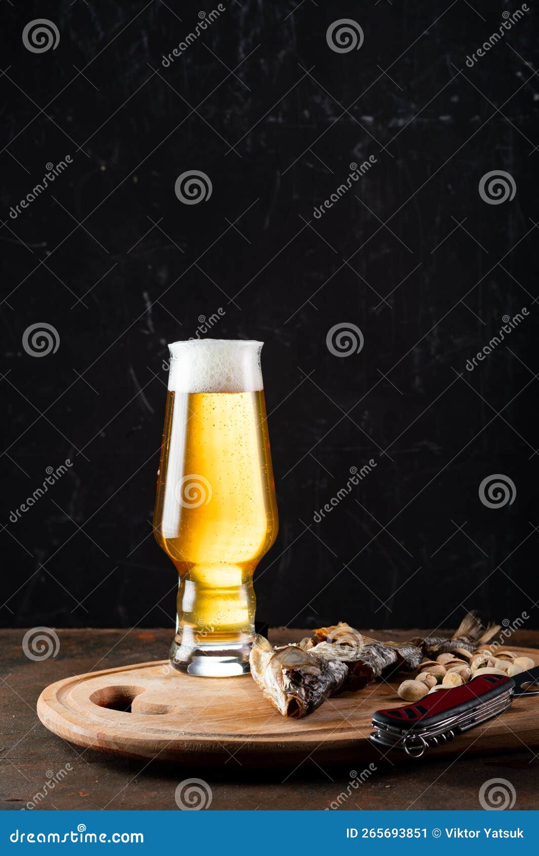 A Glass of Light Beer and Salted Fish. Beer Lager and Snacks Stock ...