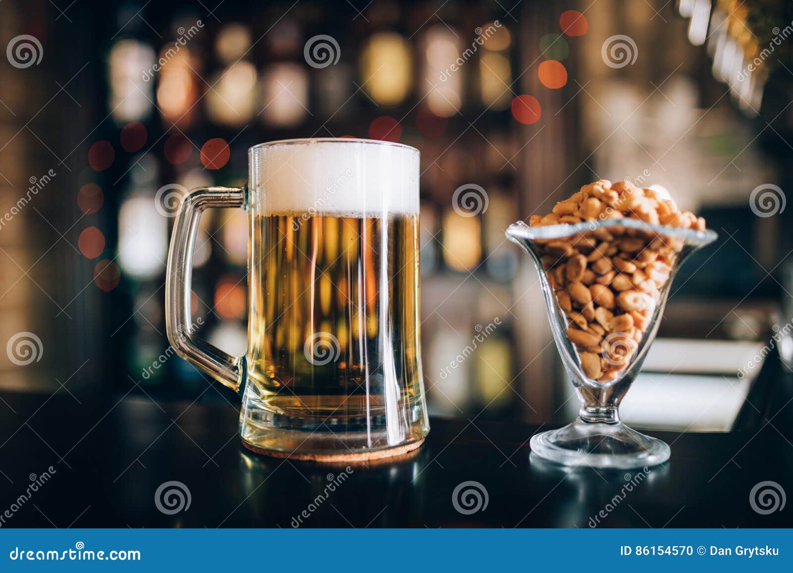 Glass of Light Cold Frothy Beer, Nuts in Pub Stock Photo - Image of ...
