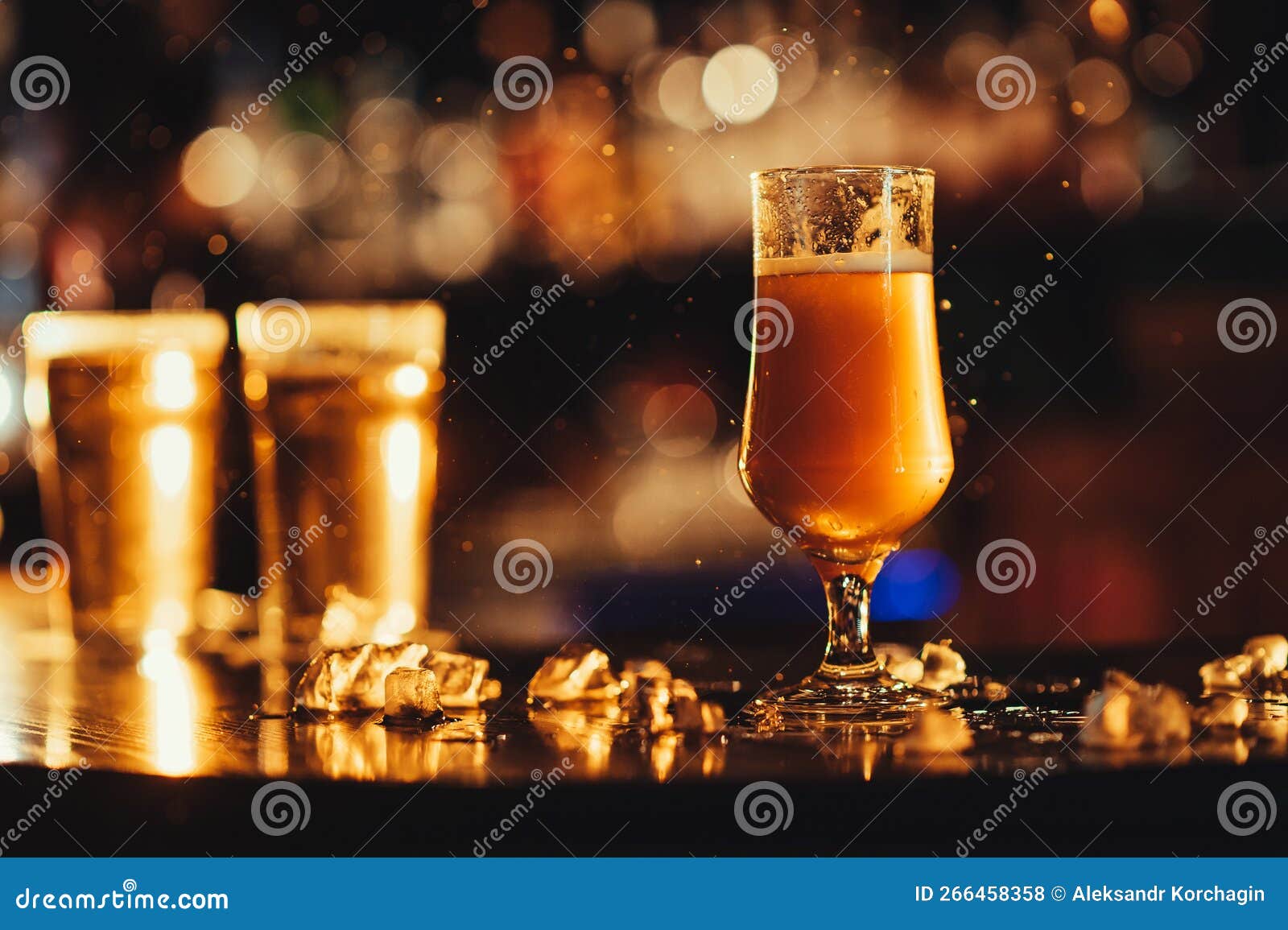 Glass of Light Unfiltered Draft Beer with on Bar Counter with Drops of ...