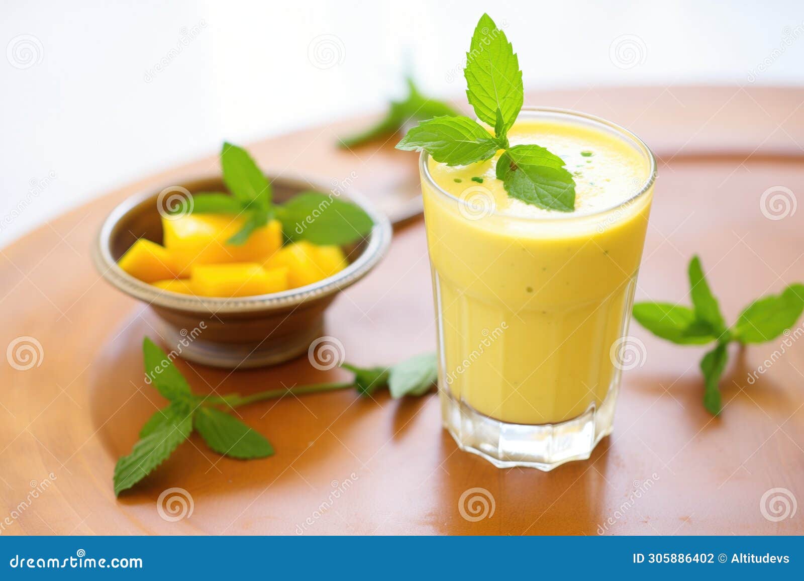 Glass of Mango Lassi Surrounded by Fresh Mangoes and Mint Leaves Stock ...