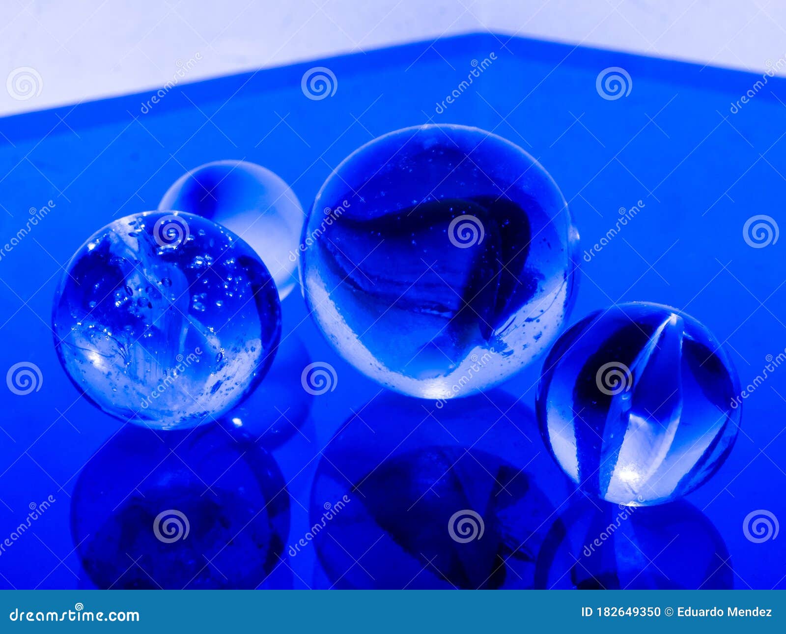 Colored Clear Glass Marbles. Stock Photo - Image of childish, blue ...