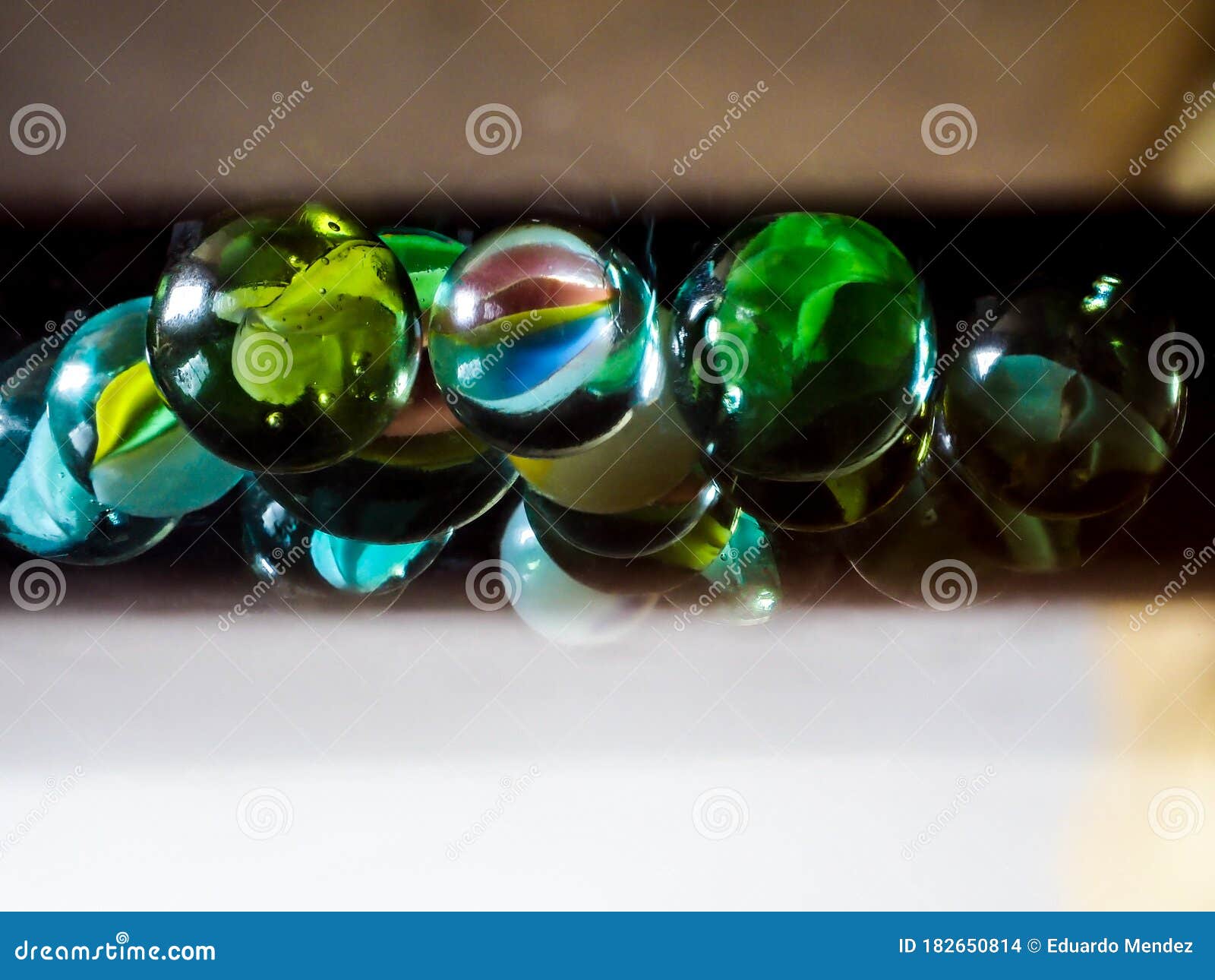Colored Clear Glass Marbles Stock Photo - Image of yellow, vessel ...