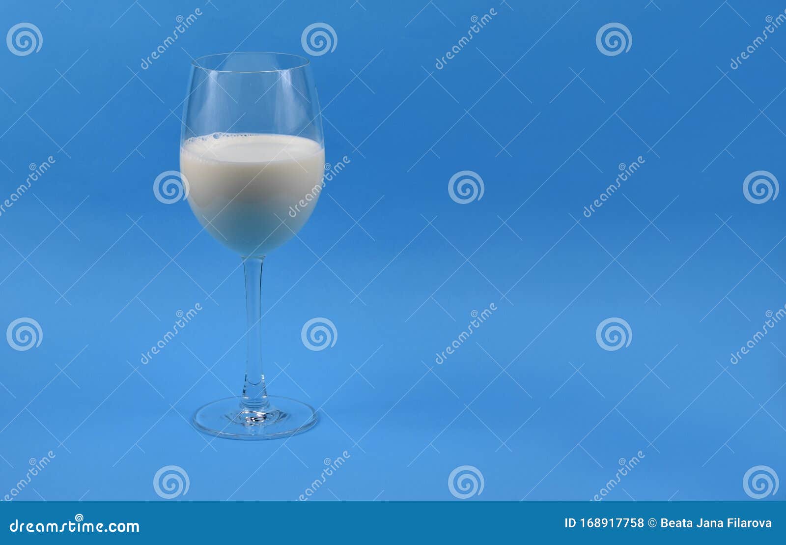 Glass of Milk on a Blue Background Stock Images Stock Photo - Image of ...