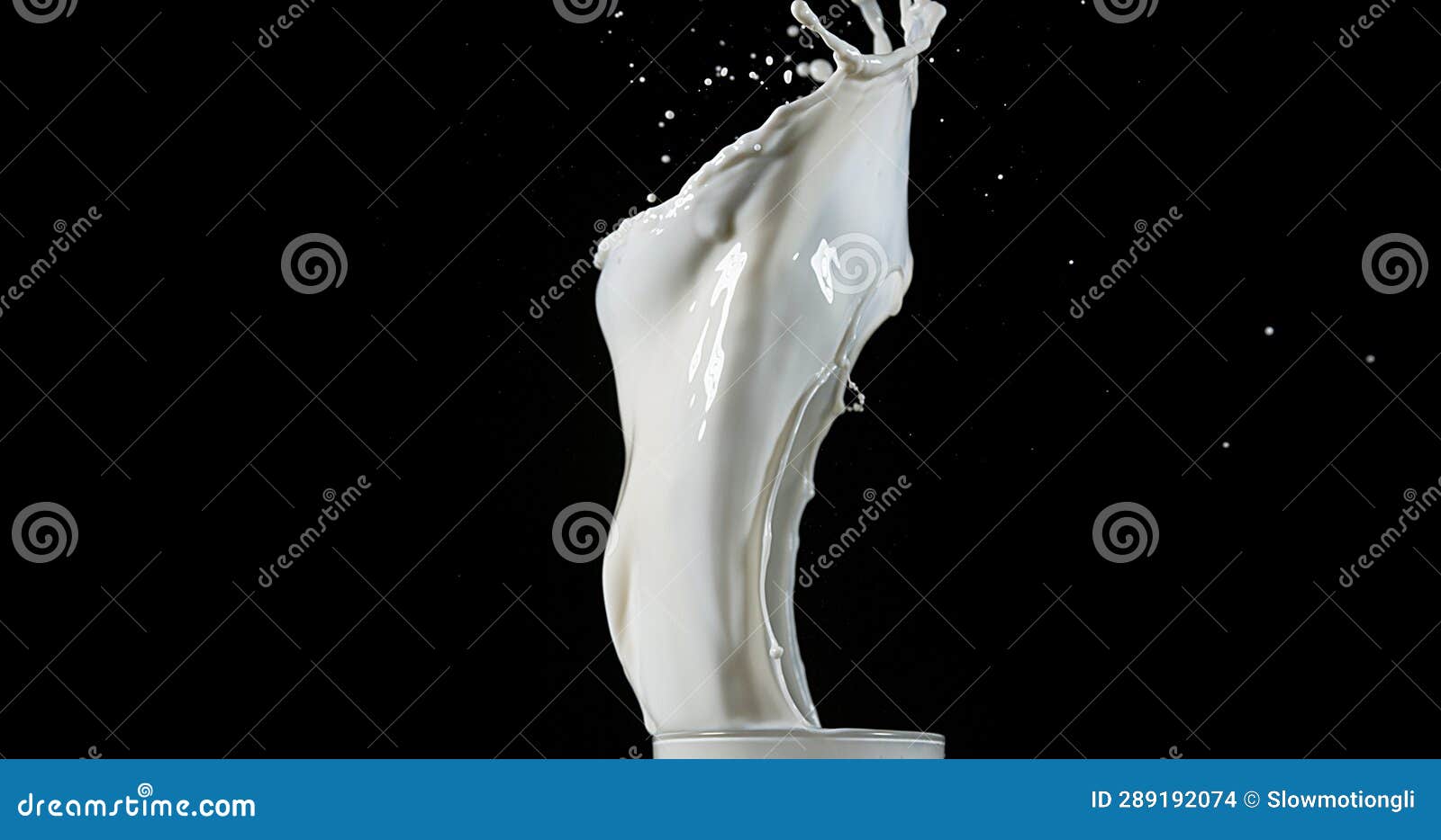 Glass of Milk Exploding Against White Background Stock Photo - Image of ...
