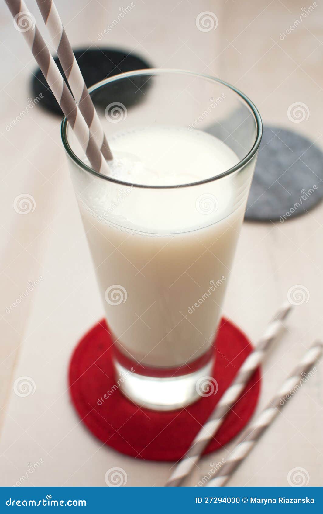 Glass of Milk with Striped Straws and Coaster Stock Photo - Image of ...