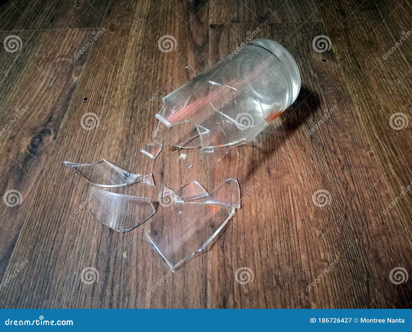 Broken Glass on the Floor. Drinking Glass Falls on the Floor. Stock ...