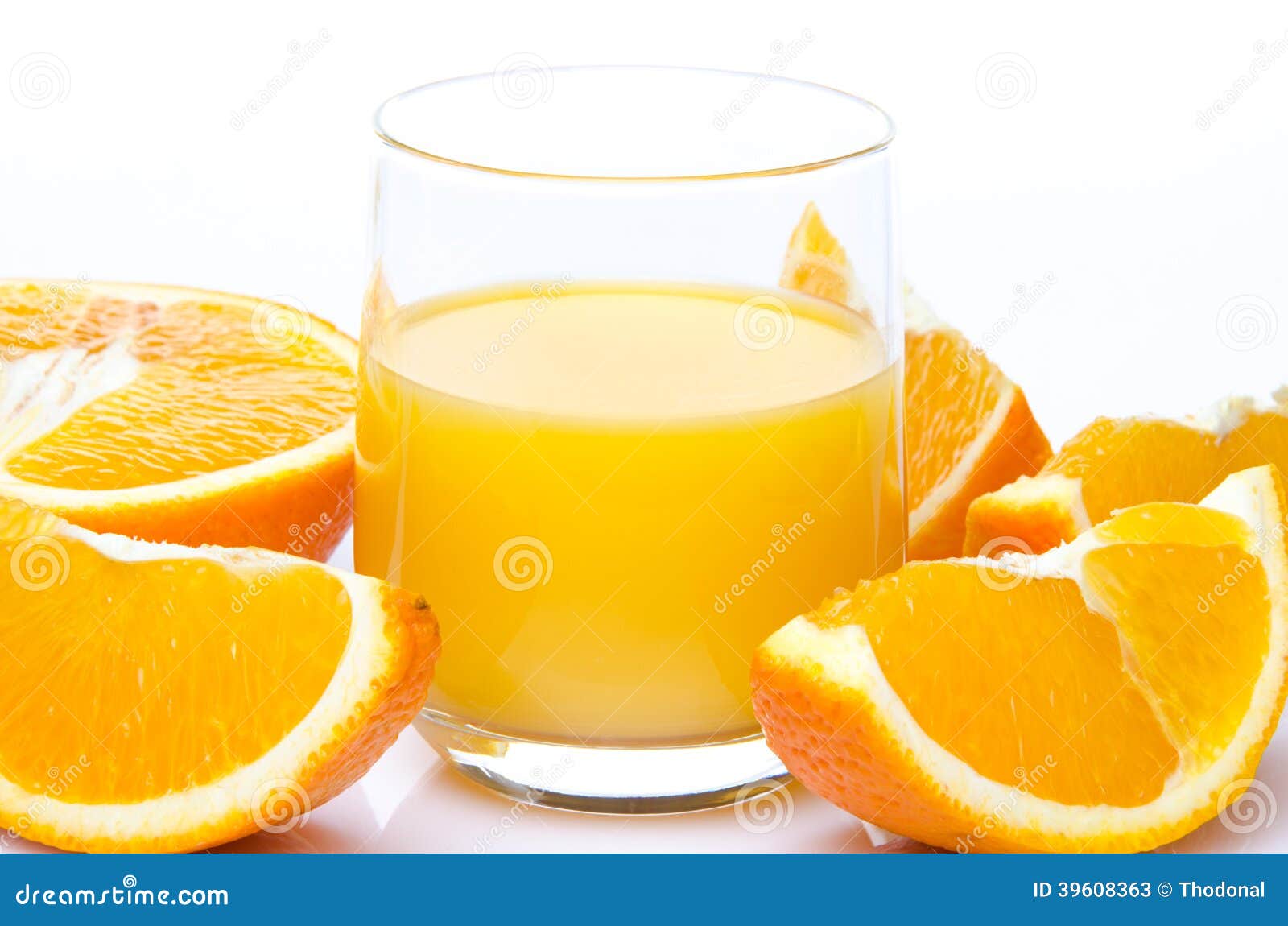 A Glass of Orange Juice with Orange Quarters Stock Image - Image of ...