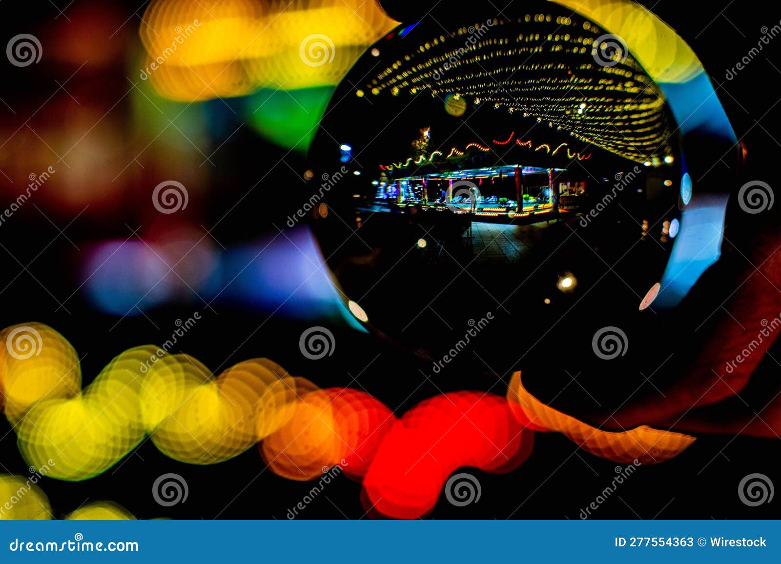 The Reflection of a Carnival or Event is Shown in a Glass Orb Stock ...