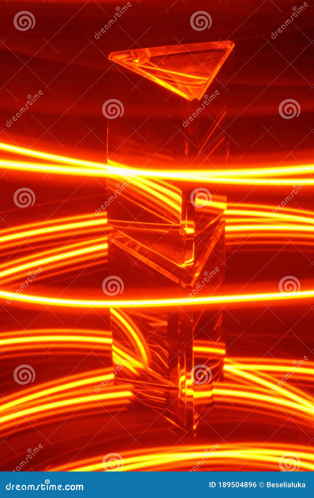 Glass Prism with Reflection on a Abstract Red and Yellow Neon Light ...