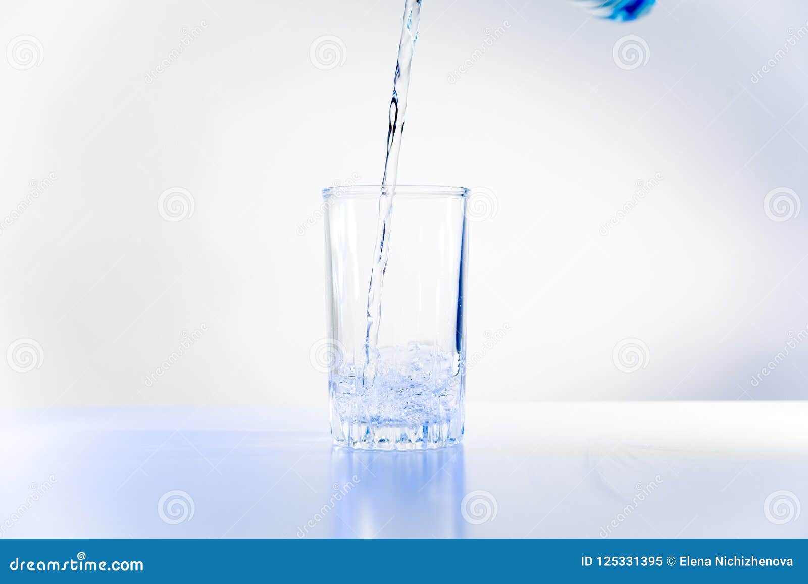 Glass of Pure Water on a White Kitchen Table Stock Image - Image of ...