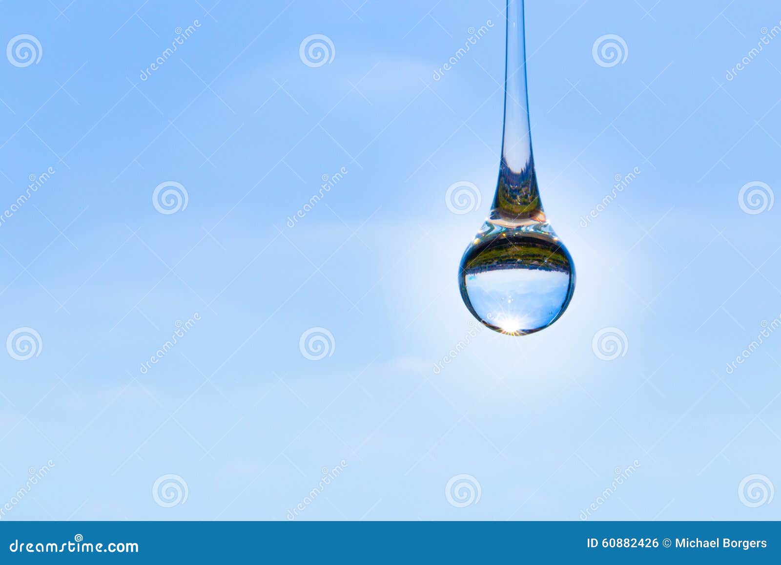 Glass raindrop on blue sky stock photo. Image of reflection - 60882426