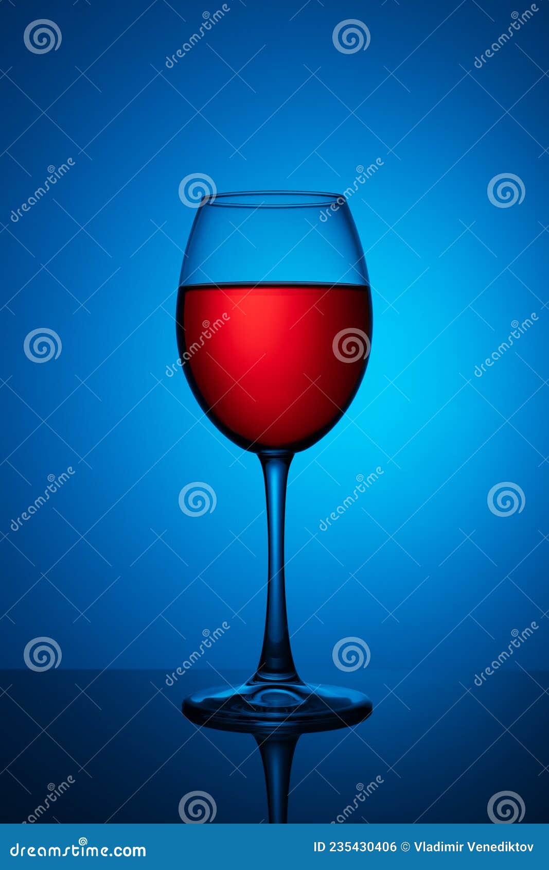 A Glass of Red Wine on a Blue Background Stock Photo - Image of party ...