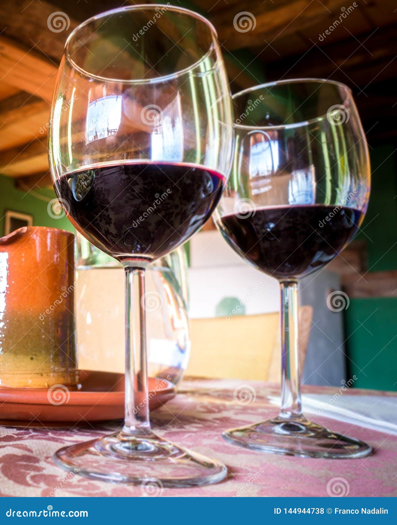 Glass of Red Wine on a Table in Rustic Restaurant Stock Photo - Image ...
